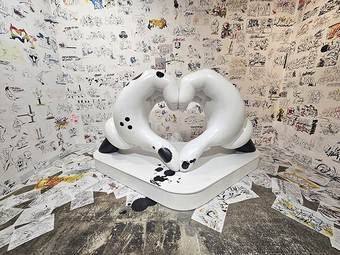 Love Gloves Sculpture: Mickey-inspired gloves form a perfect heart, proving that even the most rebellious art movement can't resist occasionally making us go "awww."