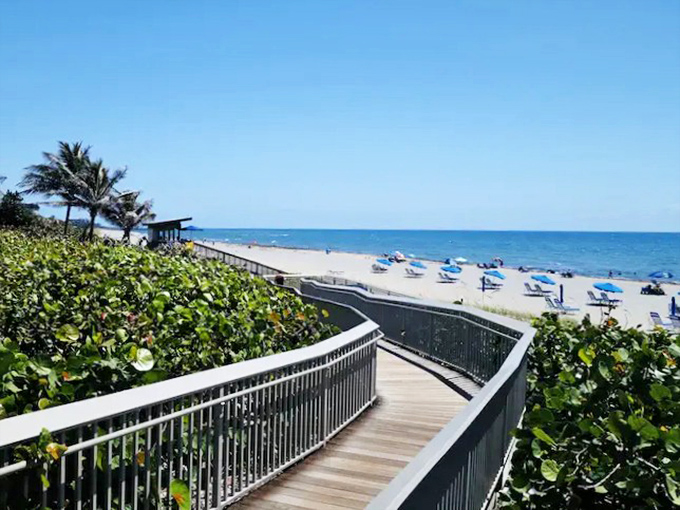 The winding boardwalk at Oceanfront Park creates a grand entrance to the beach, building anticipation with every step toward the sparkling Atlantic.