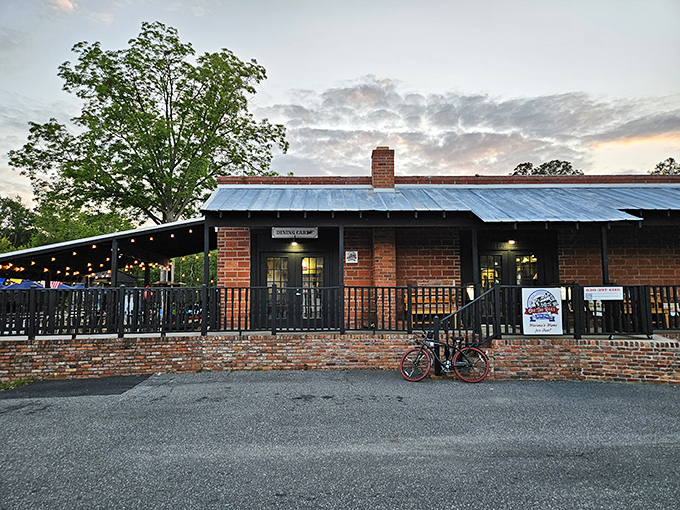 As twilight falls, Off the Rails lights up with conversation and laughter, transforming a piece of railway history into a gathering place.