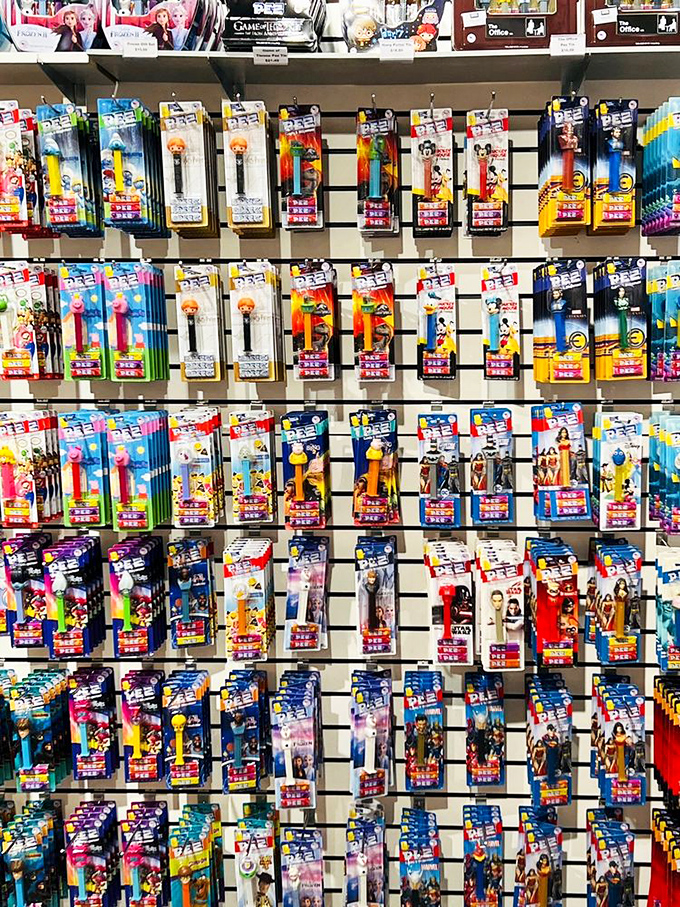 The PEZ wall represents decades of pop culture, frozen in candy-dispensing plastic—it's a toy collector's fever dream made real.