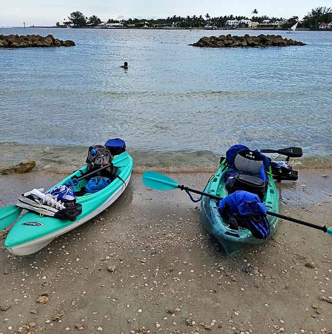 Adventure awaits with these colorful kayaks resting on shore &ndash; your chariots to hidden coves and secret snorkeling spots.