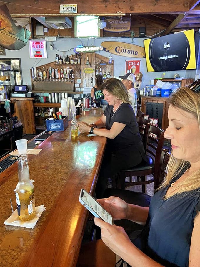 Behind the bar, an impressive tap selection and colorful signage promise cold drinks served by people who actually enjoy their jobs.