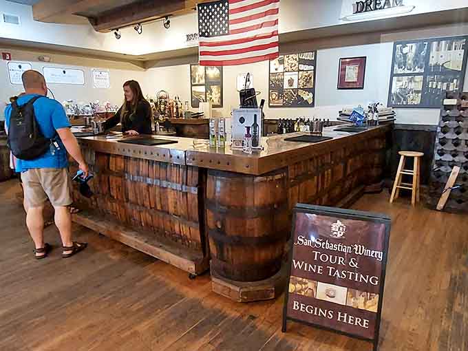 The tasting bar, crafted from wine barrels, reminds you that this place makes the magic happen right here.