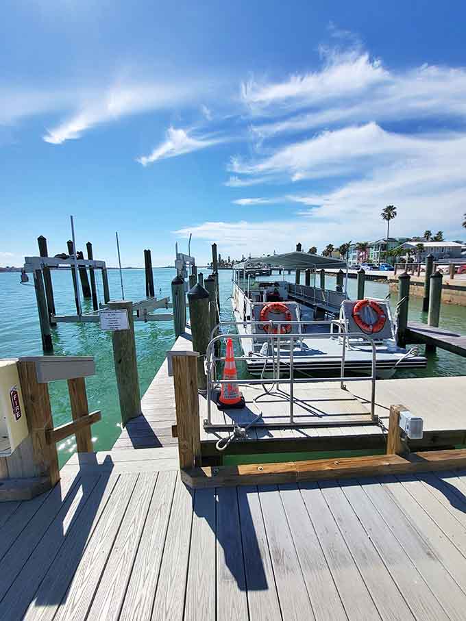 The dock stretches toward the island like a bridge between two worlds, one rushed and one refreshingly unhurried.