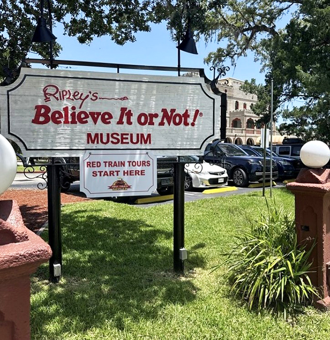 This sign directs curious explorers to both the museum and the Red Train Tours, perfect for continuing your St. Augustine adventure.