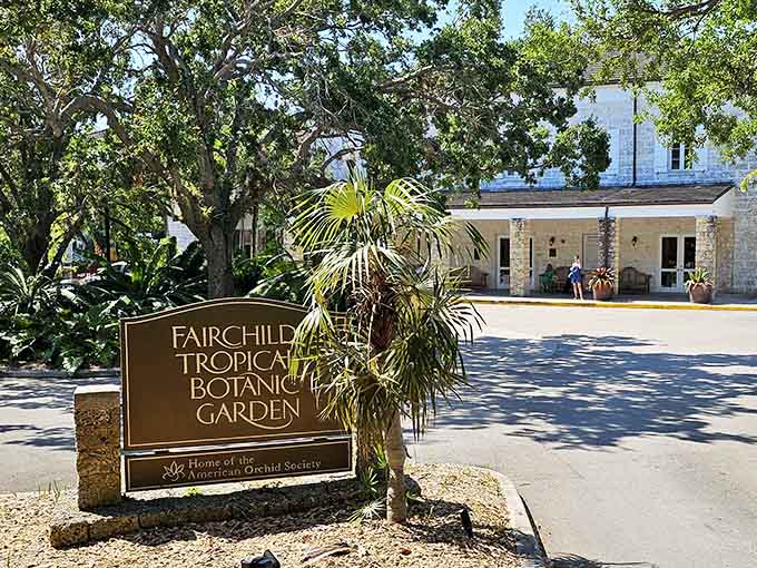 The garden's signage marks the entrance to paradise, though honestly the explosion of greenery behind it does most talking.