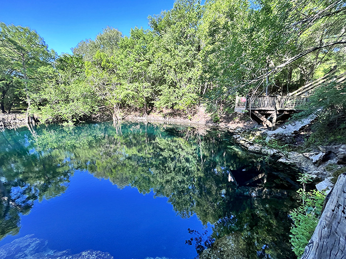 Mirror-like waters create perfect reflections, doubling the beauty of this secluded paradise. Nature showing off again!