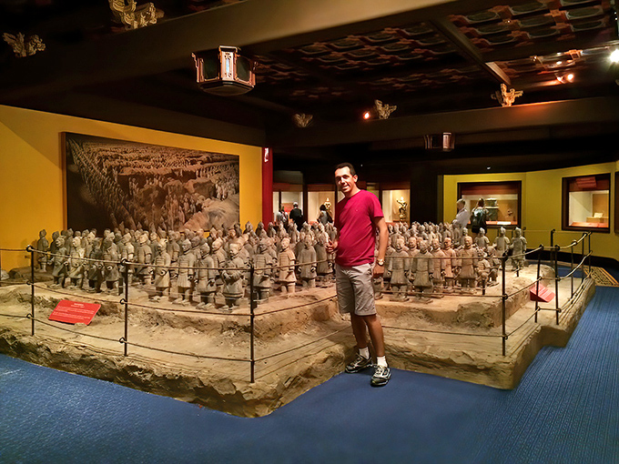 These terracotta warriors stand guard over ancient history, silently judging how many Mickey-shaped snacks you've consumed today.