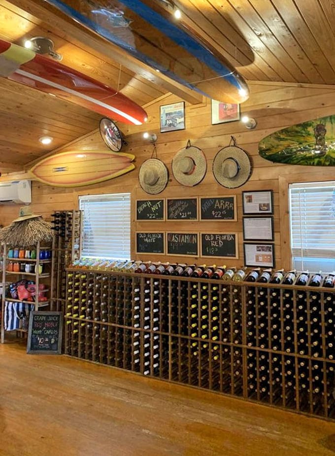 Wine bottles line the walls like edible art, each label a colorful invitation to try something new and probably buy three.