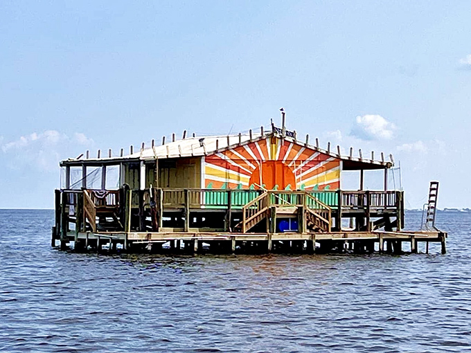 Rising sun artwork decorates this colorful outpost, proving Florida's creativity thrives even a mile from the mainland.