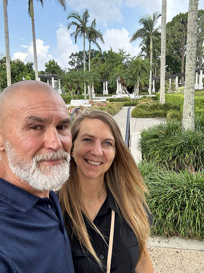 Garden enthusiasts capture the moment, their smiles as bright as the surrounding flora &ndash; human joy perfectly complementing nature's beauty.