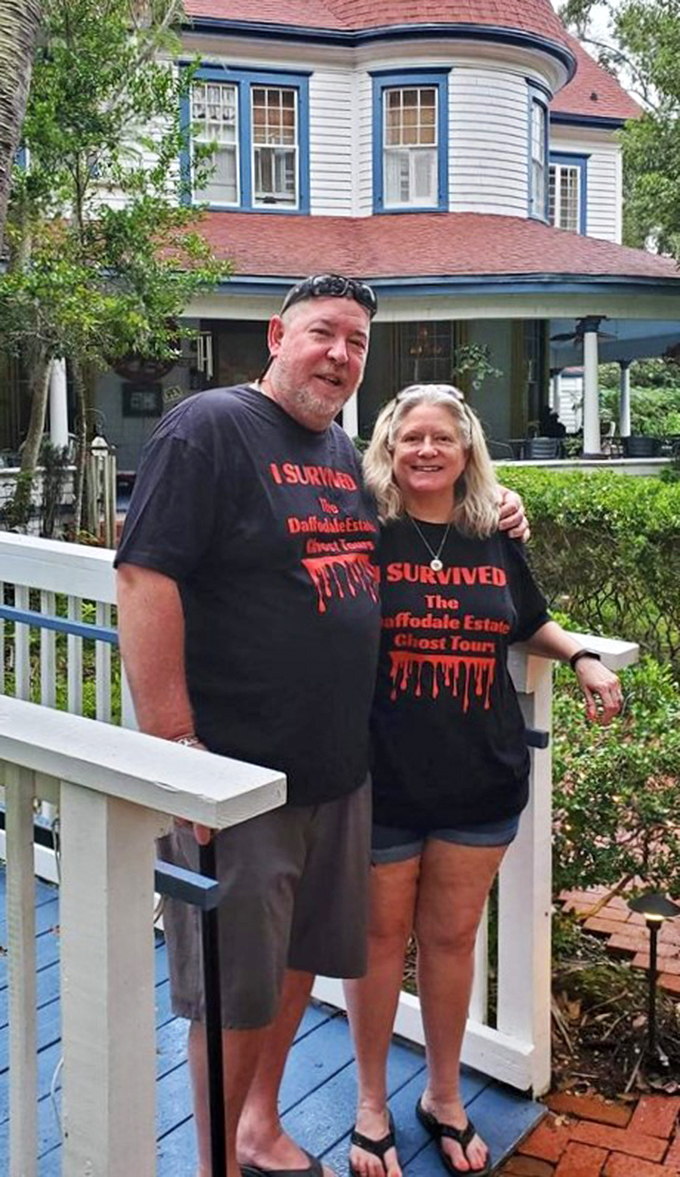 Happy visitors display their "I Survived" t-shirts, proof they braved the Daffodale Estate Ghost Tours and lived to tell their supernatural tales.