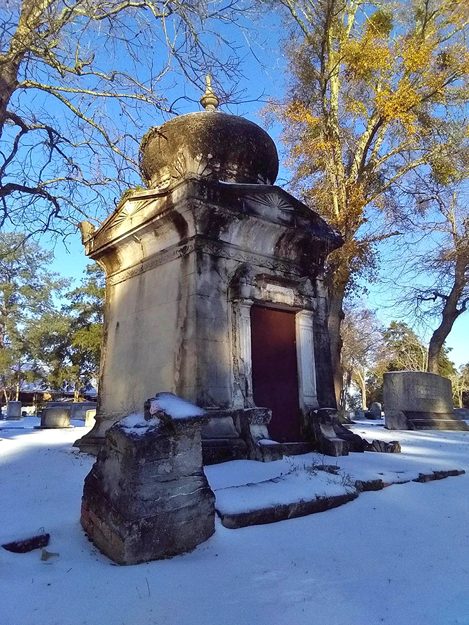 Winter transforms the mausoleum into something otherworldly, rare Florida snow dusting its dome like powdered sugar on an exotic pastry.