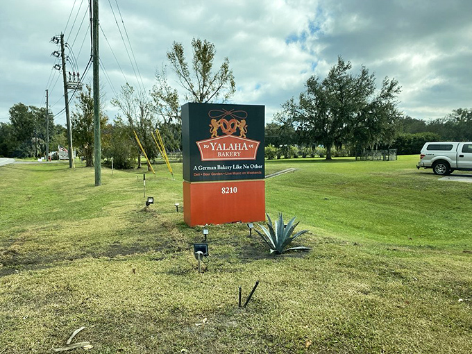 The roadside sign welcomes visitors to this German bakery oasis, standing proudly like a beacon for anyone craving authentic European baked goods.