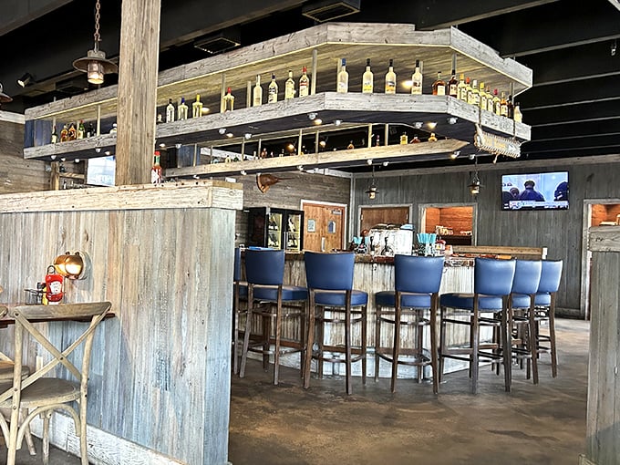 The bar beckons with promises of tropical concoctions, where blue-cushioned stools invite you to settle in for island time.