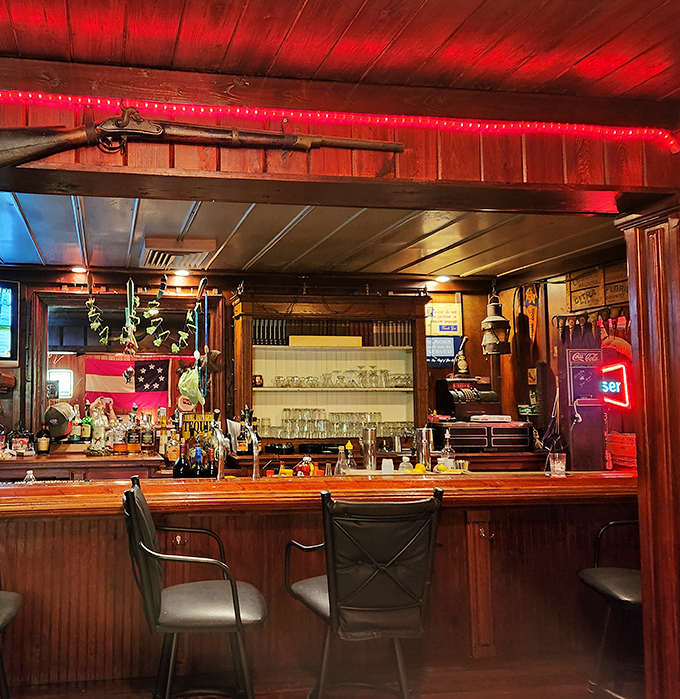 The well-stocked bar serves everything from ice-cold beer to cocktails featuring local citrus, all in a cozy, wood-paneled setting.