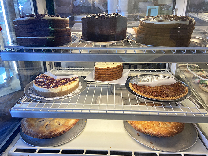 The dessert case&mdash;or as I call it, "The Museum of Temptation." Each shelf displays edible masterpieces that make willpower wave the white flag of surrender.