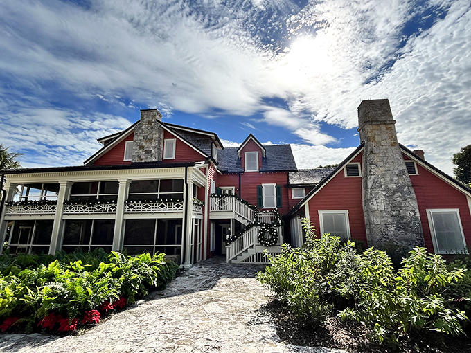 The Richmond Cottage stands proudly in its Victorian splendor, its red facade a bold statement against Miami's tropical palette.