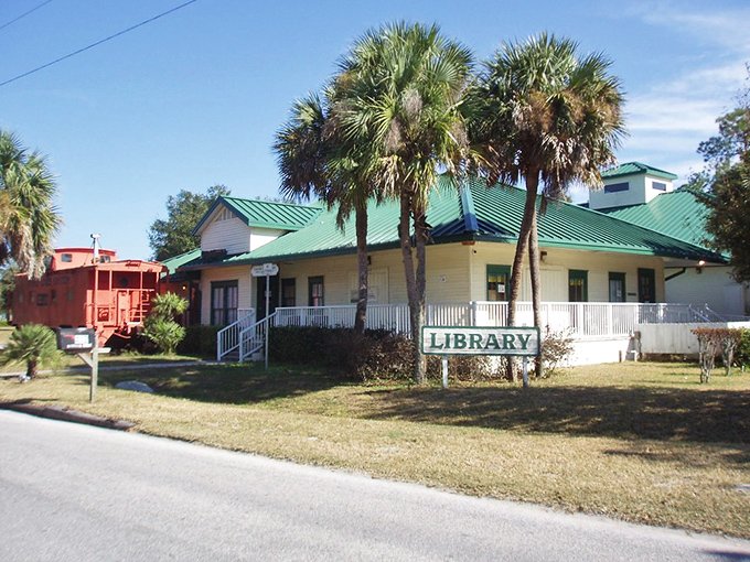Umatilla's charming library, complete with vintage red caboose, serves as both knowledge hub and community gathering space.