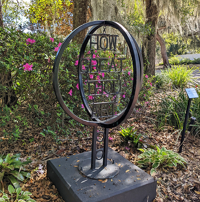 "HOW GREAT THOU ART" reads this circular metal sculpture, combining word play and artistic form in a thoughtful garden installation.
