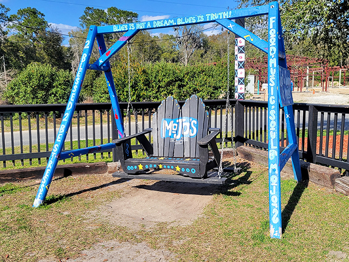 "Blues is truth" proclaims this whimsical blue swing, inviting visitors to pause and sway to the rhythm of good food and good vibes.