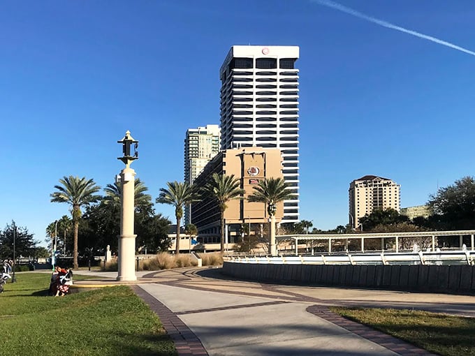 Grassy areas sit beside the fountain, offering visitors perfect picnic spots with million-dollar views of water and sky.