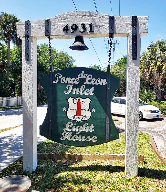 The entrance sign welcomes visitors with vintage charm, the hanging bell a reminder of simpler communication methods before text messages and tweets.