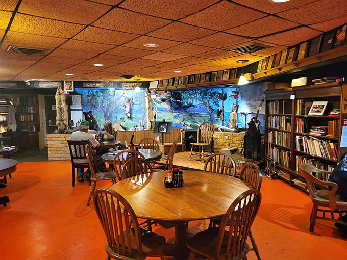 The dining area feels like someone's eccentric Florida living room, where wooden chairs gather around tables beneath a ceiling of warm, amber tiles.
