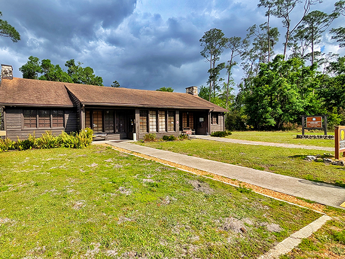 The rustic visitor center welcomes explorers with its old-Florida charm, a gateway to adventures waiting beyond its wooden doors.