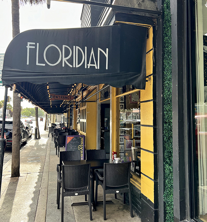 The Floridian's black awning creates elegant contrast against sunny yellow walls on Fort Lauderdale's famous Las Olas Boulevard.