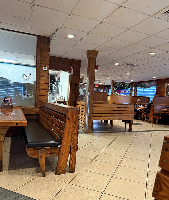 Wooden booths and nautical touches create that authentic "Old Florida" atmosphere that no amount of corporate restaurant design could ever replicate.