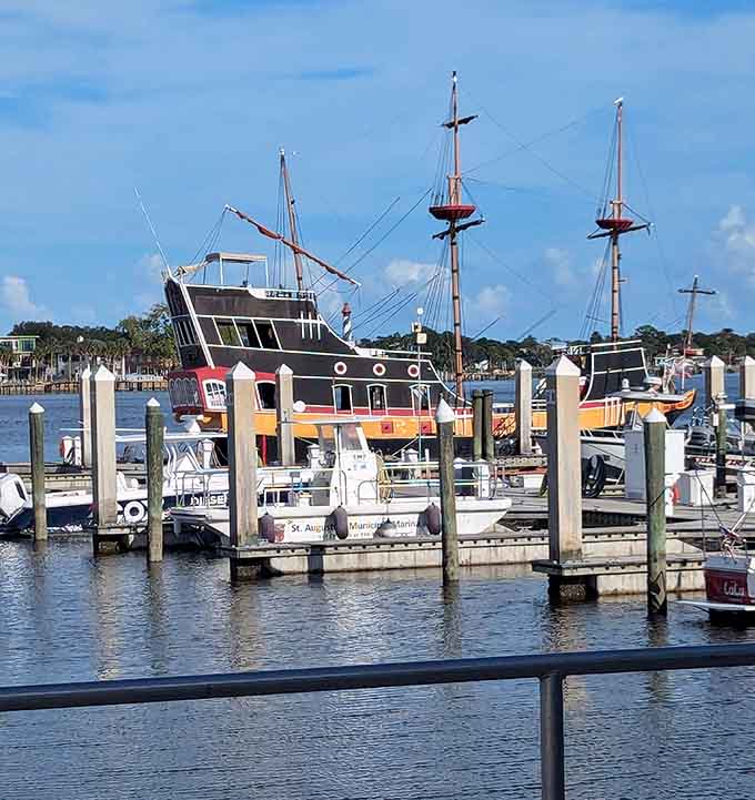 Nestled among modern boats, the Black Raven stands out like a history book that decided to come to life and go sailing.
