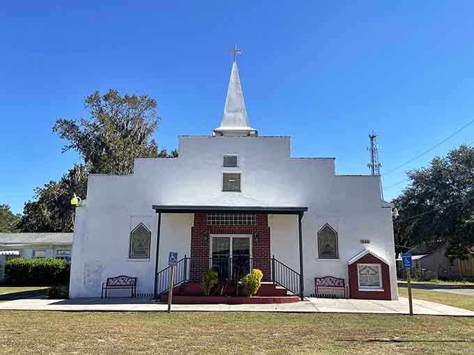 Small-town churches like this one have anchored communities for decades, their steeples pointing skyward like permanent prayers.