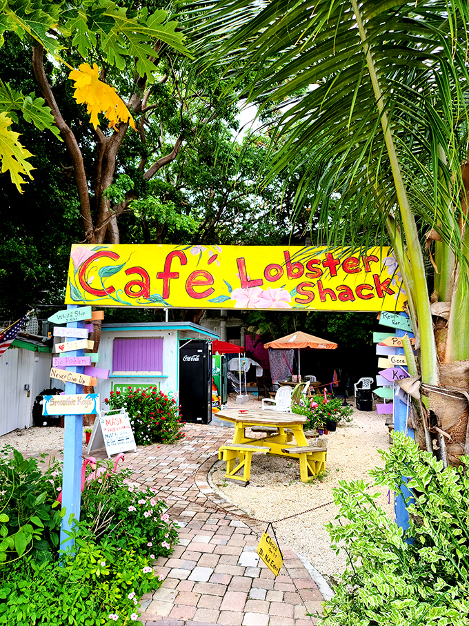 The Lobster Shack's vibrant signage and yellow picnic table create the perfect Keys vignette&mdash;casual, colorful, and completely unapologetic about its charm.