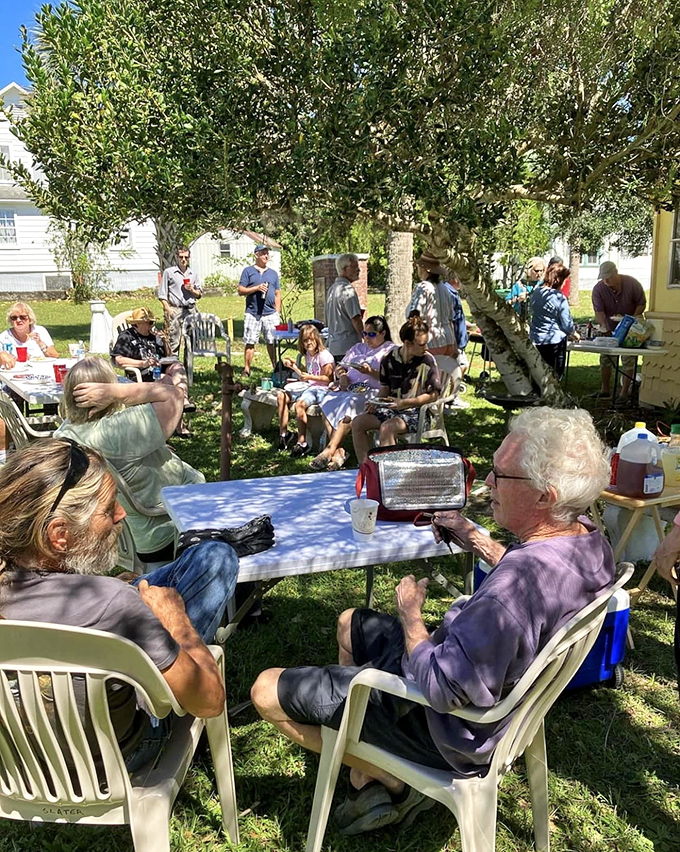 Tables set up on grassy areas become impromptu meeting places, a throwback to a time when communities actually communed rather than just occupied space.