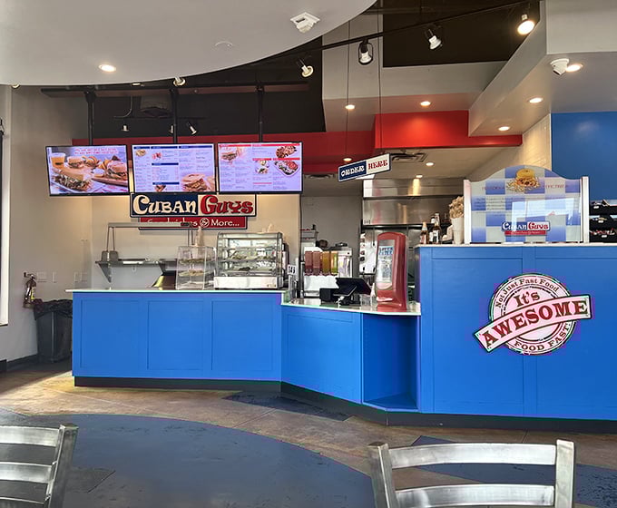 Where sandwich dreams begin! The counter's vibrant blue pops against red accents, creating an inviting space to place the order that'll make your day.