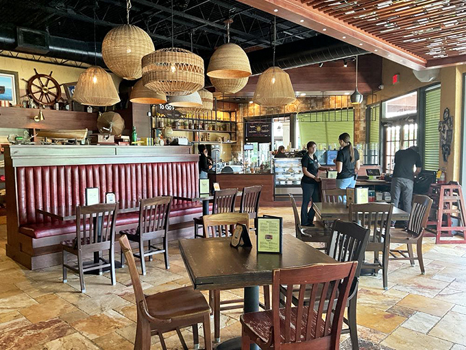 Woven pendant lights cast a warm glow over the dining area, where literary inspiration meets culinary creativity in perfect harmony.