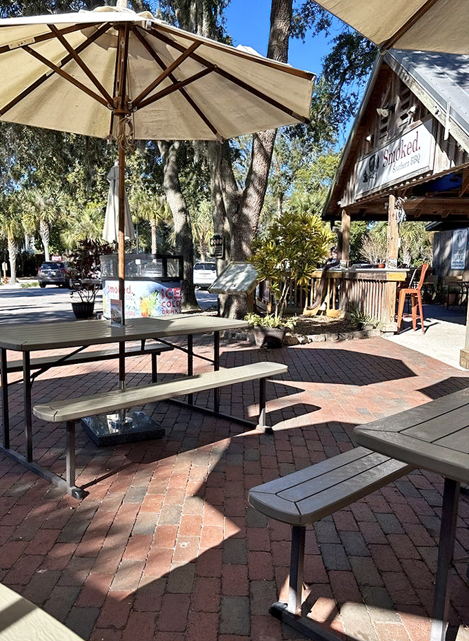 Refuel under shady umbrellas where history and hunger meet, with peacocks potentially plotting to steal your sandwich.