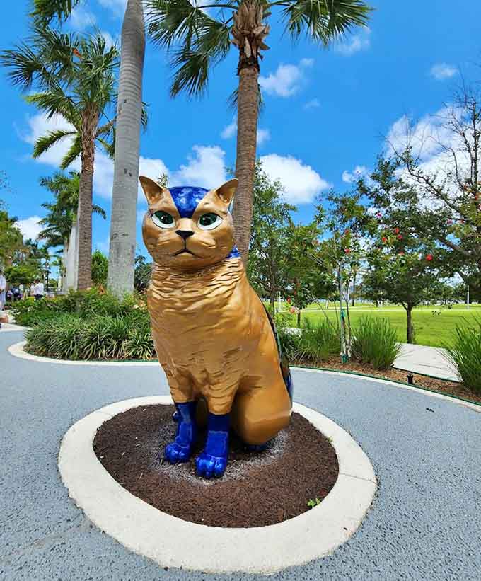 A golden cat with blue accents sits like royalty, which is exactly how every cat sees itself anyway.
