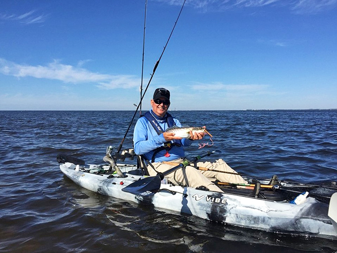 Fishing from a kayak – where the office cubicle feels like it's on another planet and "catching up" means something entirely different.