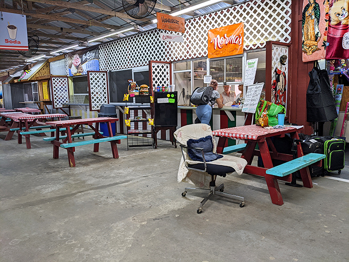 The market's food court offers a colorful respite for weary shoppers, with picnic tables that have witnessed countless deals.