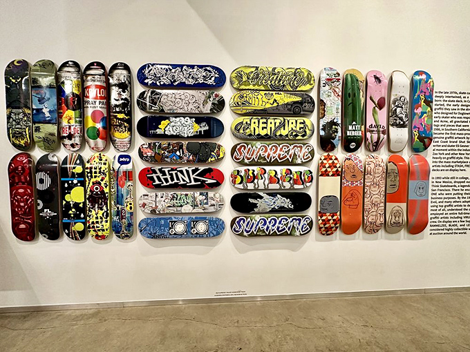 Graffiti Skate Deck Wall: Skateboard decks transformed into miniature masterpieces show how street culture creates its own canvas when traditional ones aren't available or affordable.