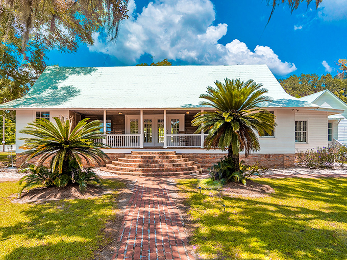Twin palms stand sentinel at Havana Springs, where the brick pathway seems to whisper "slow down" with every step toward the gracious porch.
