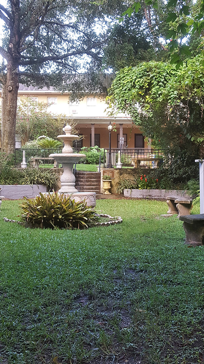 Water trickles peacefully in this garden sanctuary where orbs frequently appear in visitors' photos. The benches invite contemplation of both natural beauty and supernatural possibilities.