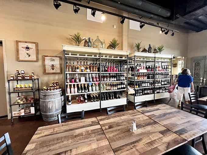 A wine wall that would make any collector weep with joy, organized better than your life will ever be, offering endless delicious possibilities.