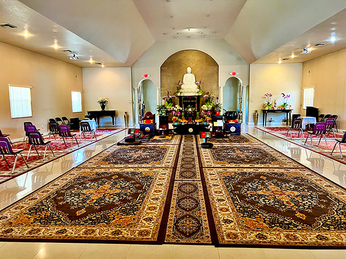 Inside the meditation hall, ornate rugs and simple cushions create a space where even first-timers feel welcome to sit.