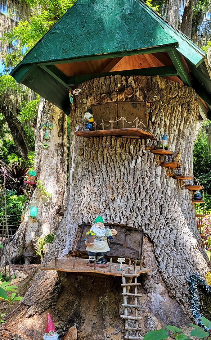 A miniature village scene where gnomes have apparently established a functioning society with better infrastructure than some actual towns, complete with tiny furniture and decorative touches.