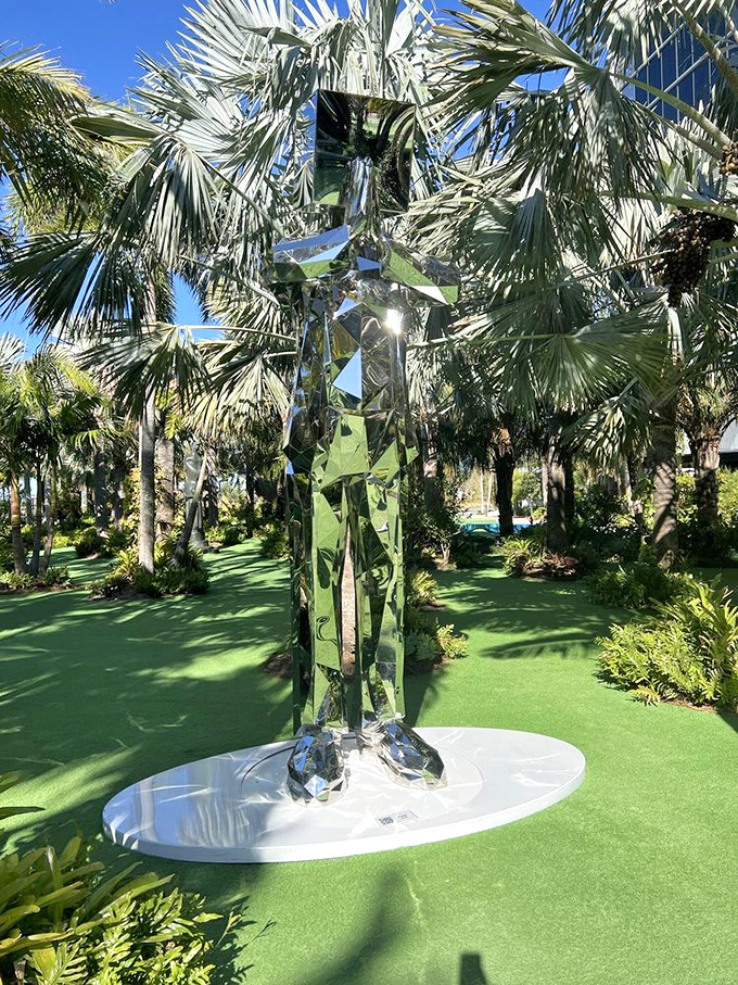 Reflecting both sky and surroundings, this mirrored figure transforms throughout the day, becoming a living part of the environment.