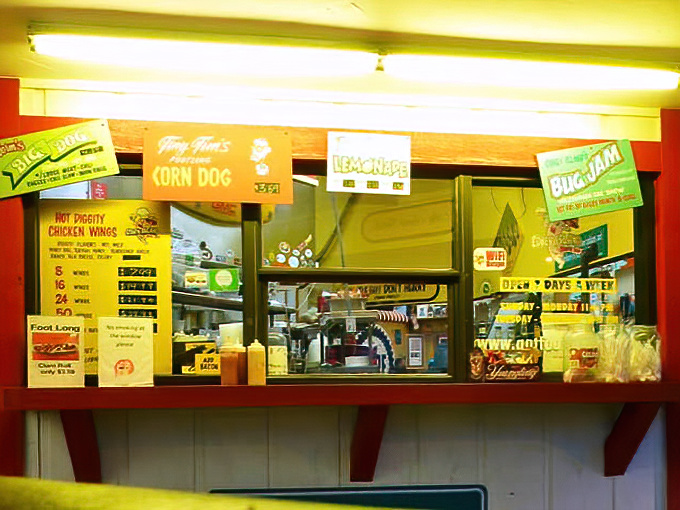 The outdoor service window keeps the drive-in tradition alive, perfect for grabbing a quick dog without leaving your air-conditioned car.