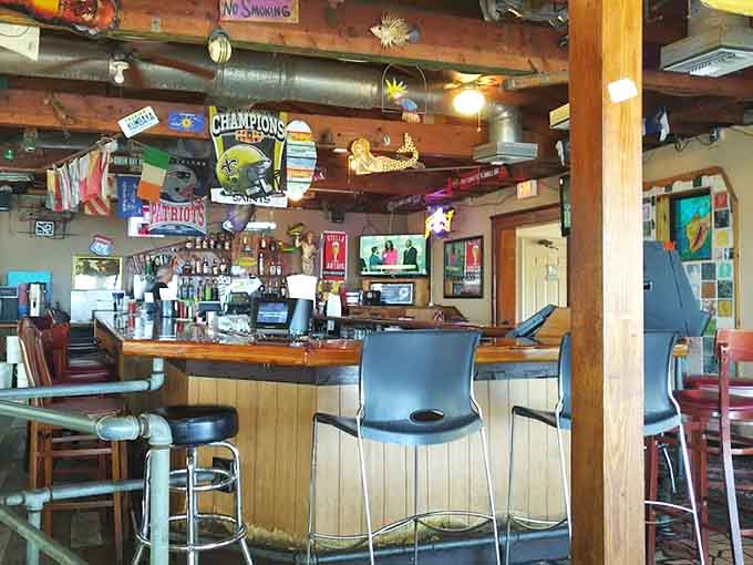 Behind the bar, an impressive selection and colorful signage promise cold drinks served by people who actually enjoy their jobs and customers.